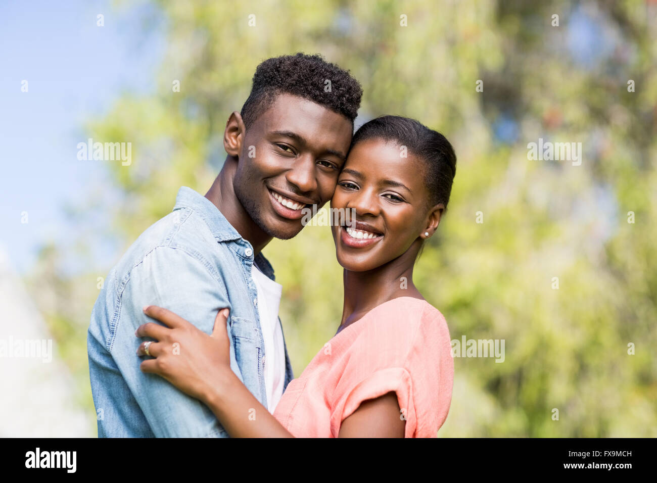 Happy couple posing together Stock Photo - Alamy