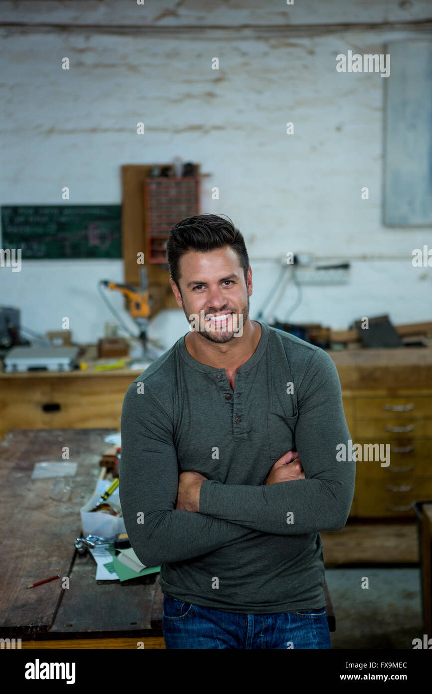 A carpenter is posing with his arms crossed Stock Photo - Alamy