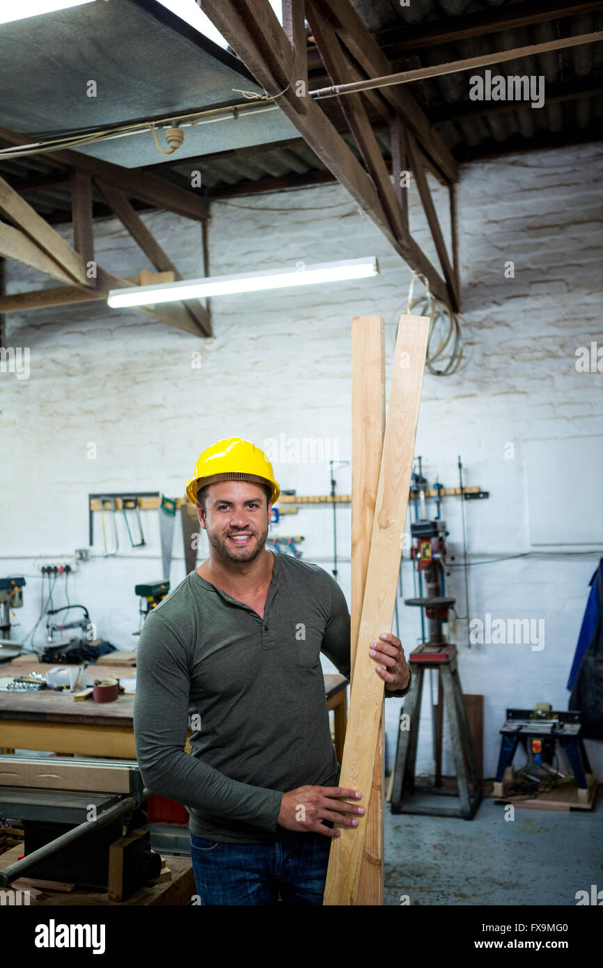 Carpenter is posing with his craft Stock Photo - Alamy