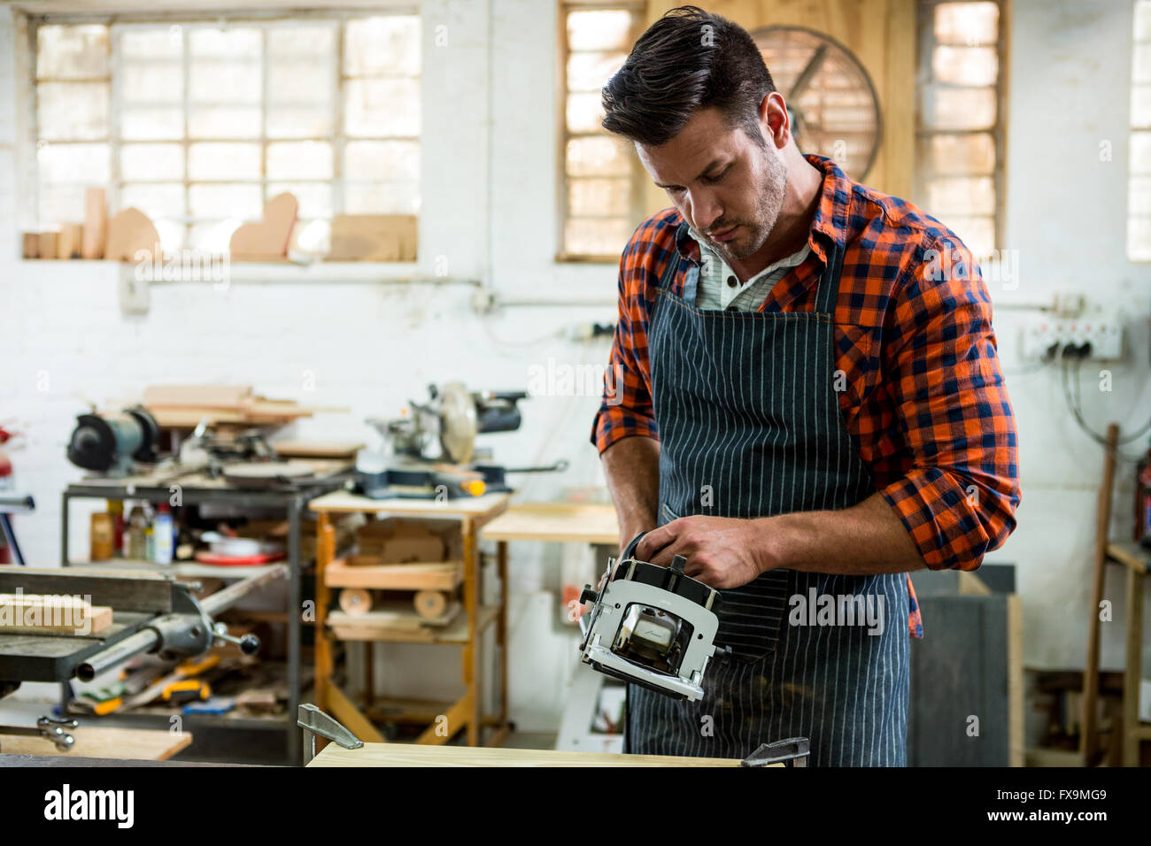 Carpenter working on his craft Stock Photo - Alamy