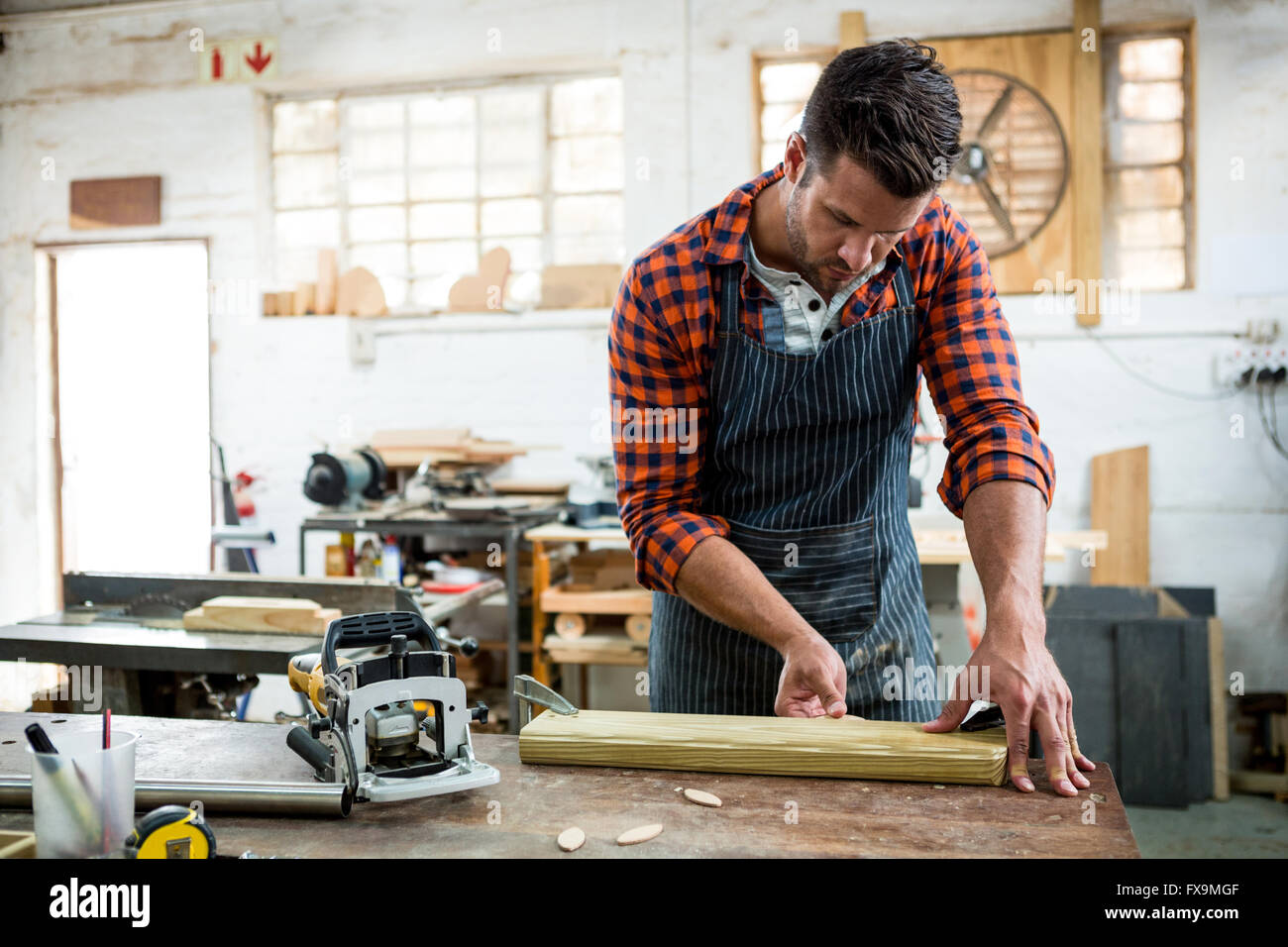 Carpenter working on his craft Stock Photo - Alamy