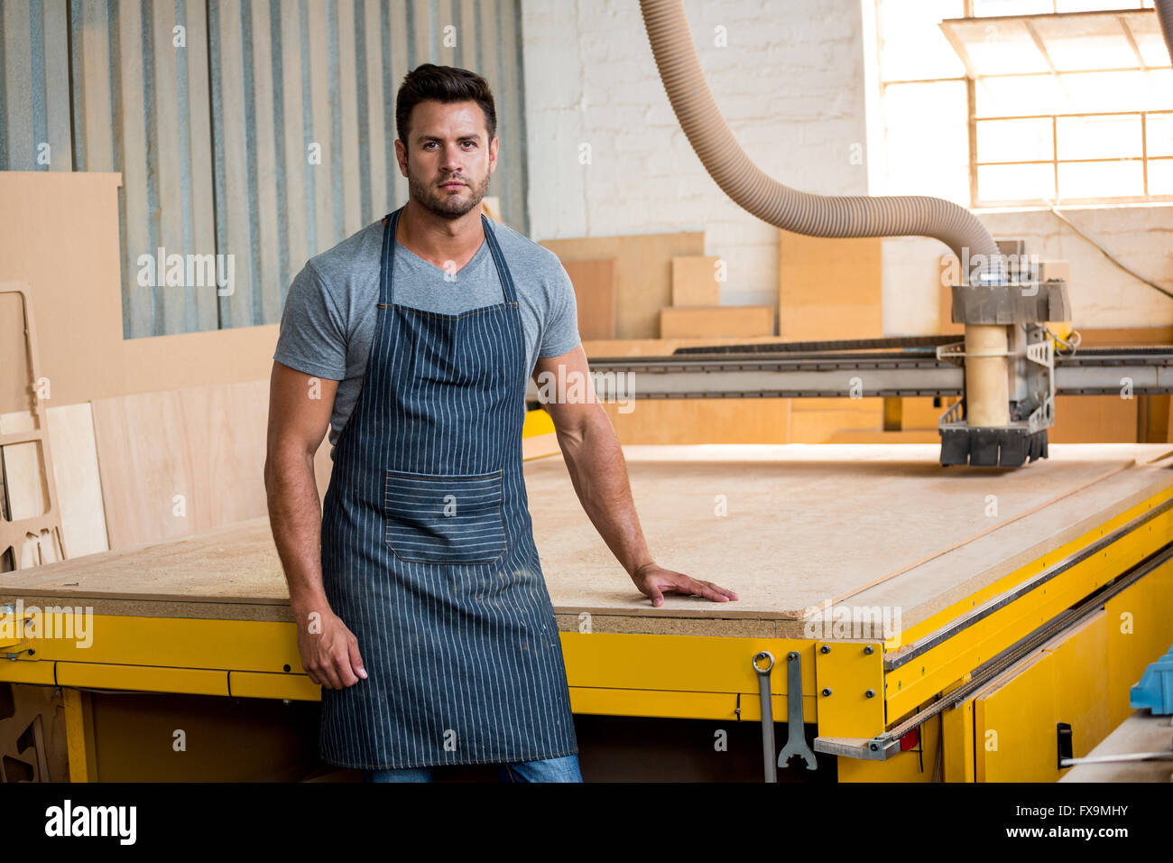 Carpenter is posing with his craft Stock Photo - Alamy
