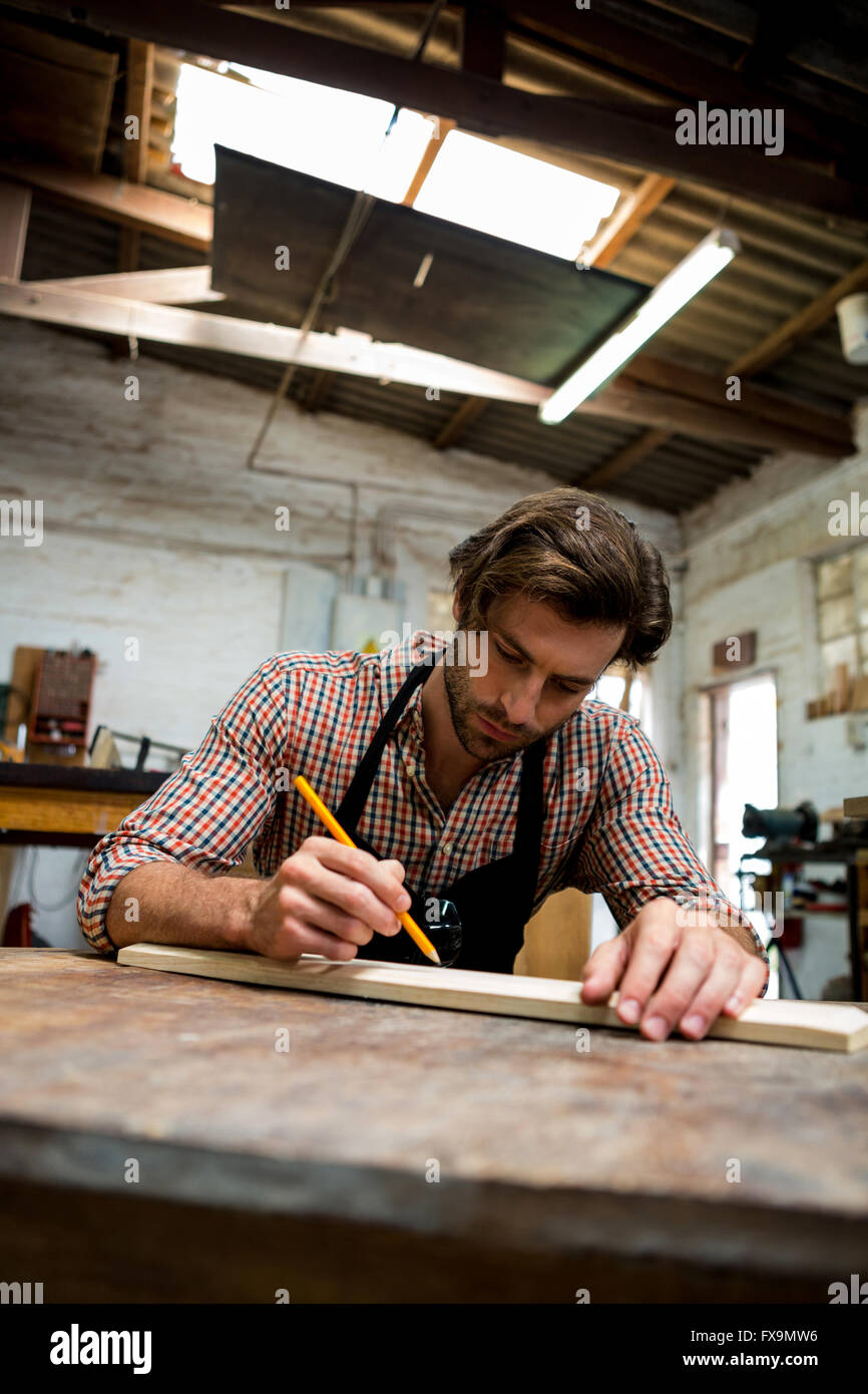 Carpenter working on his craft Stock Photo - Alamy