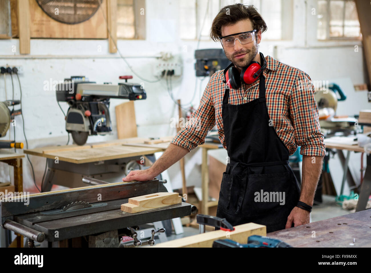 Carpenter is posing with his craft Stock Photo - Alamy