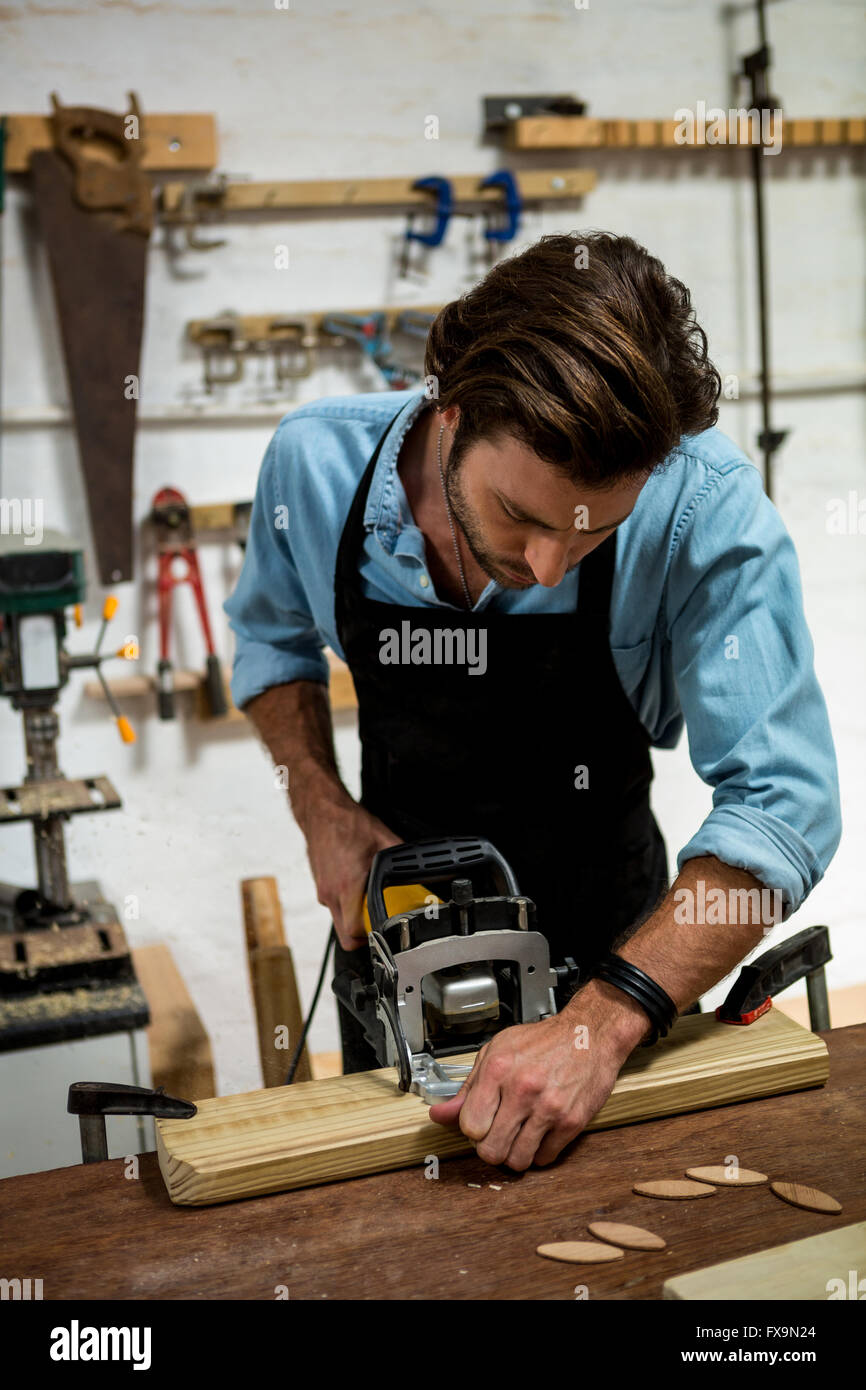 Carpenter working on his craft Stock Photo - Alamy