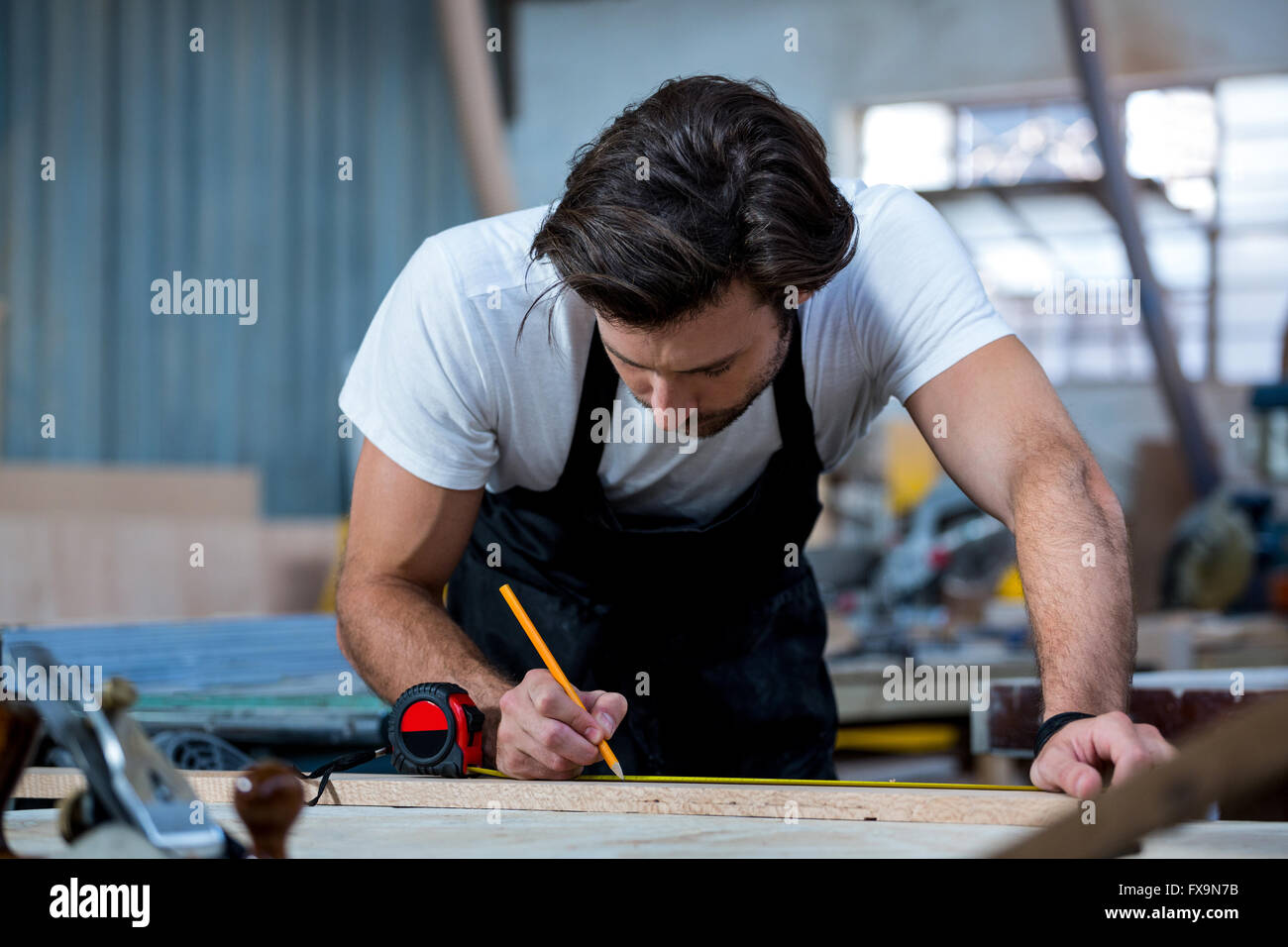 Carpenter working on his craft Stock Photo - Alamy