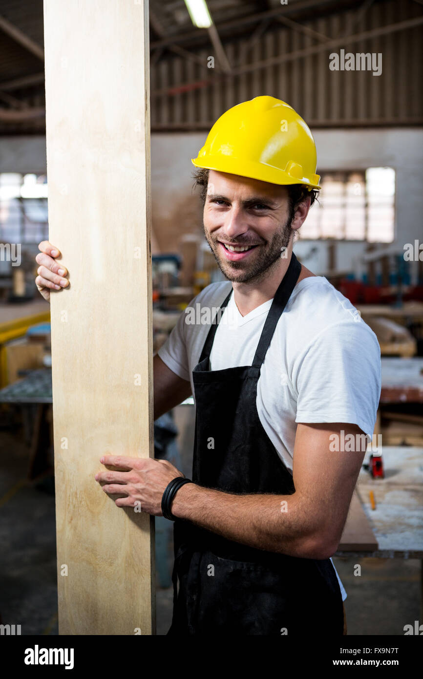 Carpenter is posing with his craft Stock Photo - Alamy