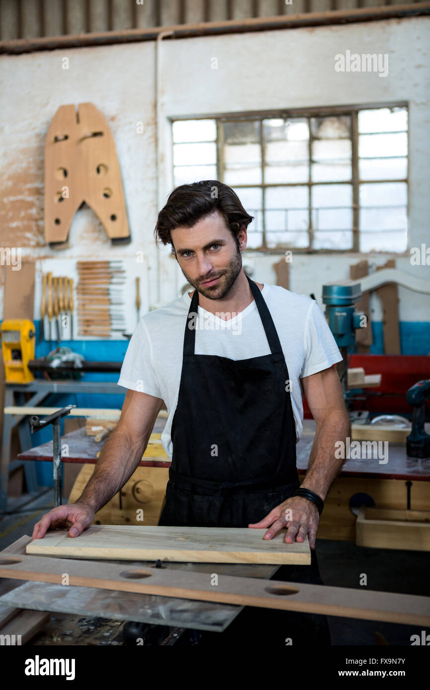Carpenter is posing with his craft Stock Photo - Alamy