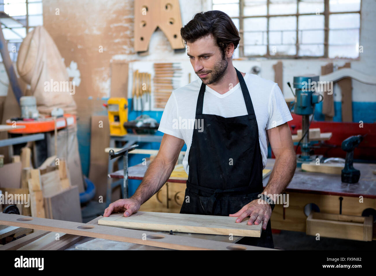 Carpenter working on his craft Stock Photo - Alamy