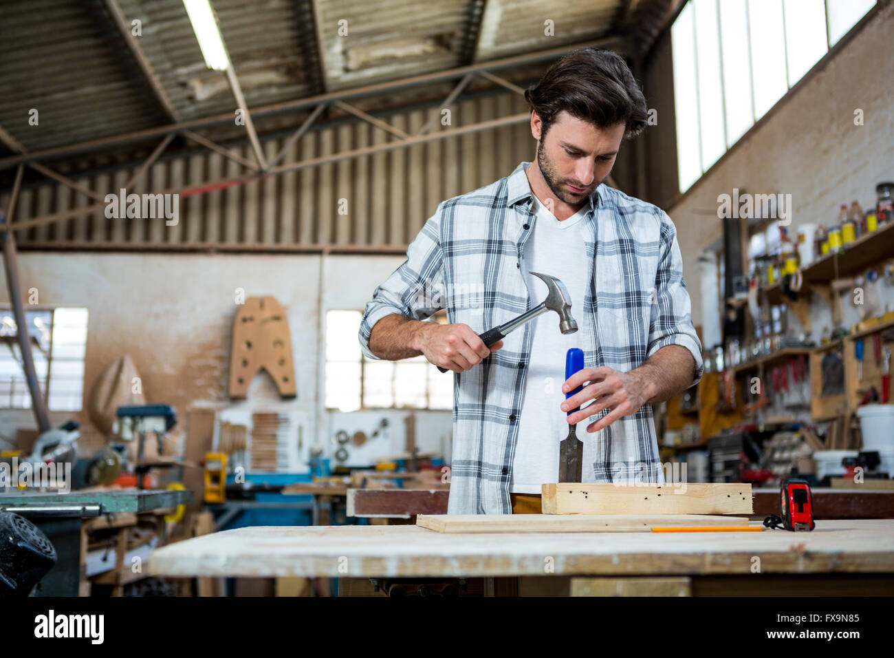 Carpenter working on his craft Stock Photo - Alamy