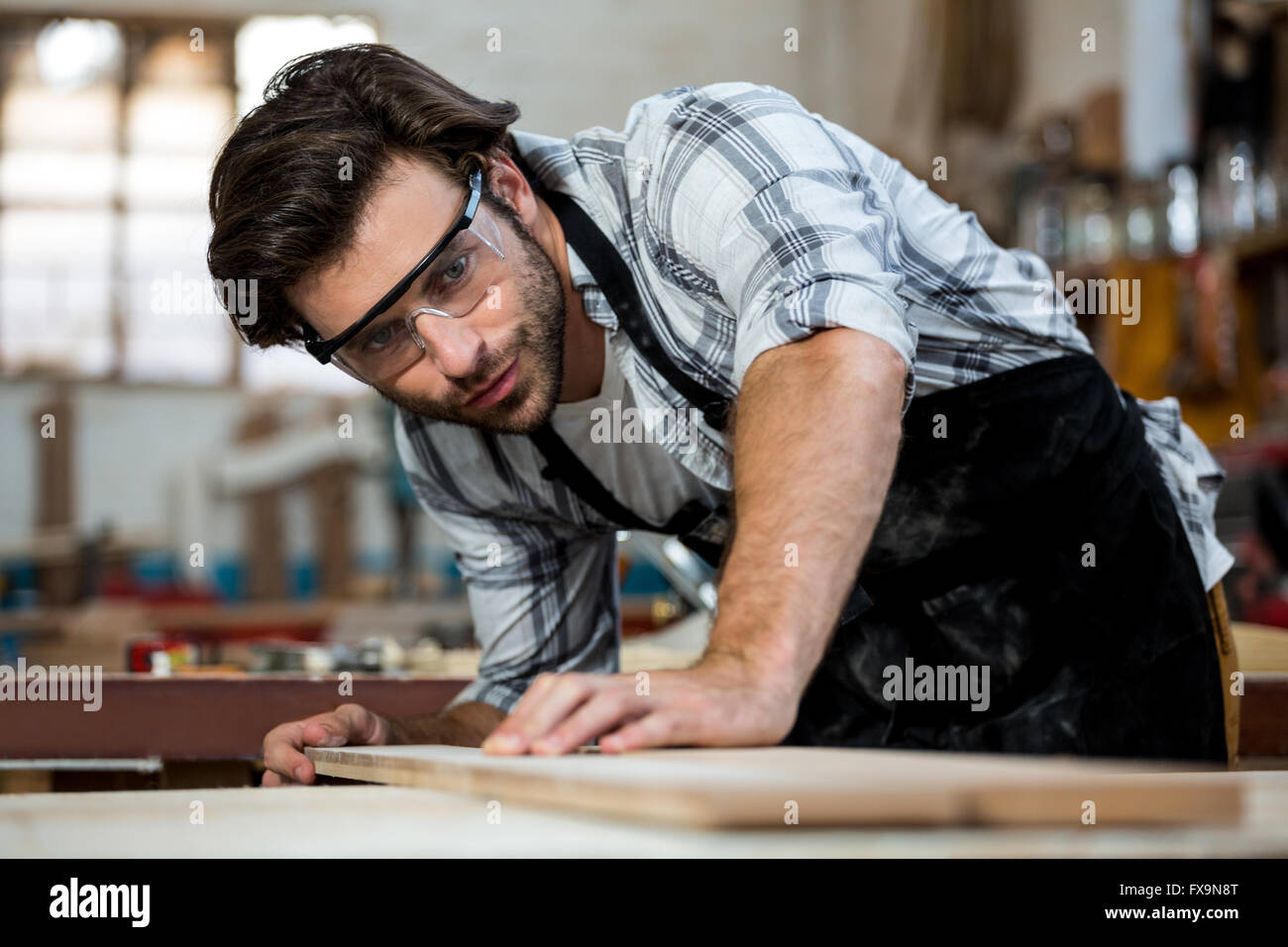 Carpenter working on his craft Stock Photo - Alamy