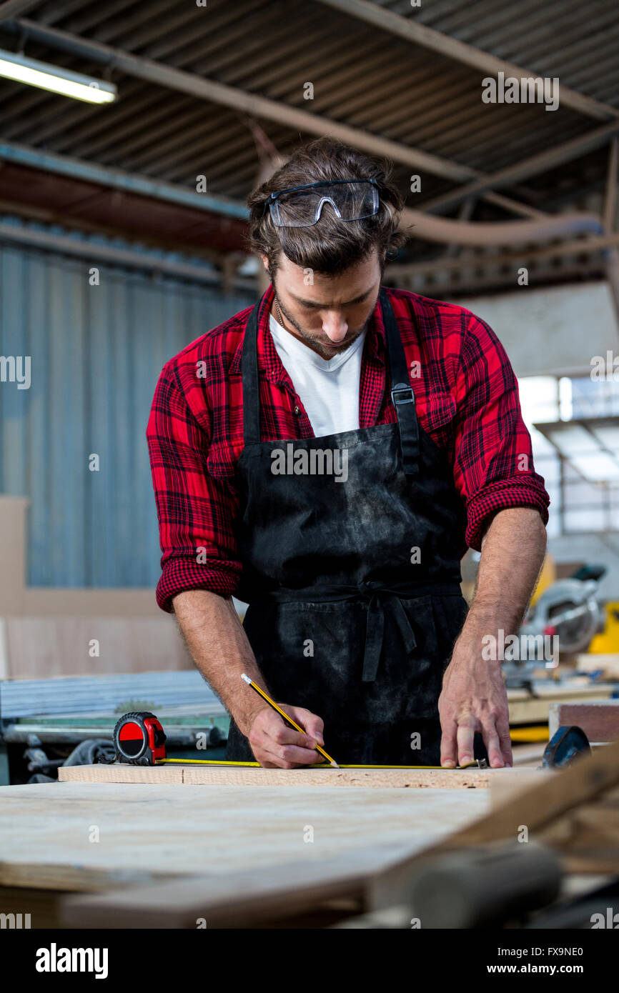 Carpenter working on his craft Stock Photo - Alamy