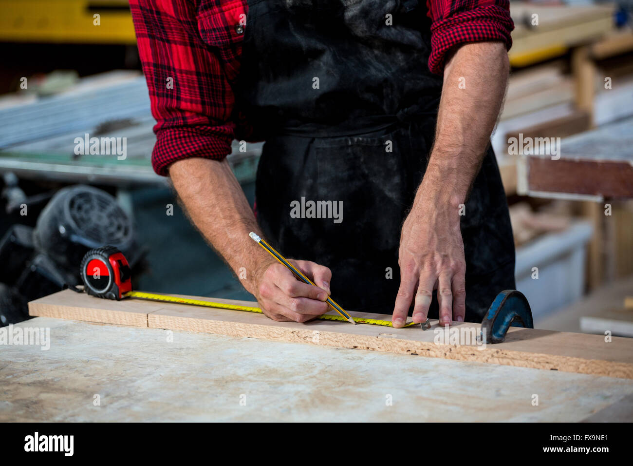 Carpenter working on his craft Stock Photo - Alamy