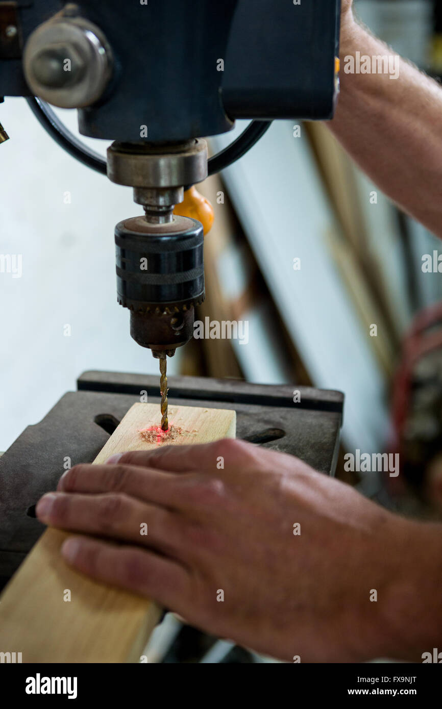 Carpenter using a drill Stock Photo - Alamy