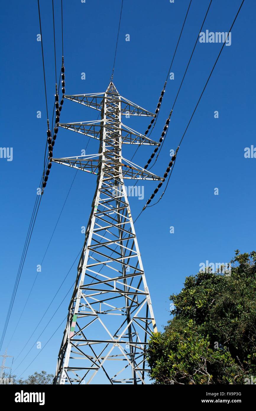 Steel support of overhead power transmission line on sky background ...