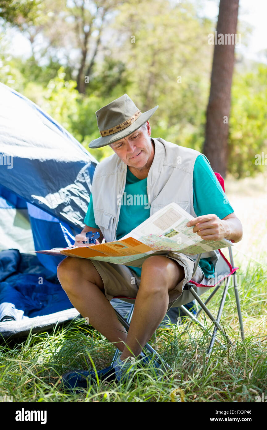 senior man reading beside his tent Stock Photo - Alamy