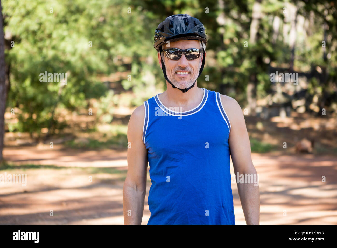 Mature bike rider man posing Stock Photo - Alamy