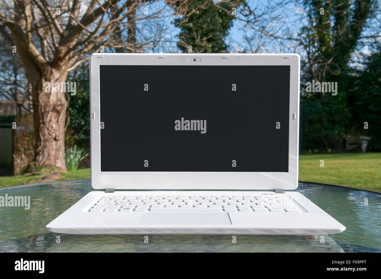 Modern laptop with a blank screen outside on a sunny day Stock Photo ...