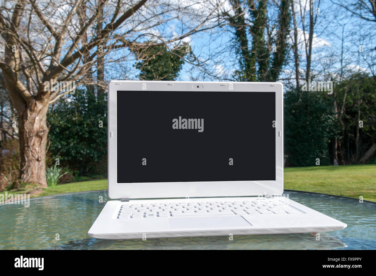 Modern laptop with a blank screen outside on a sunny day Stock Photo ...