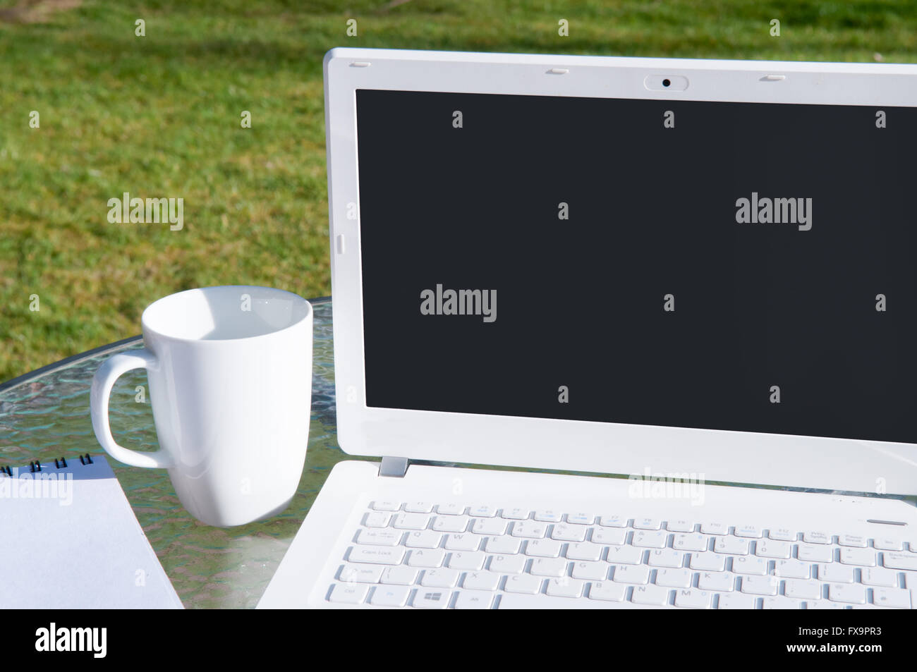 Modern laptop with a blank screen outside on a sunny day Stock Photo ...