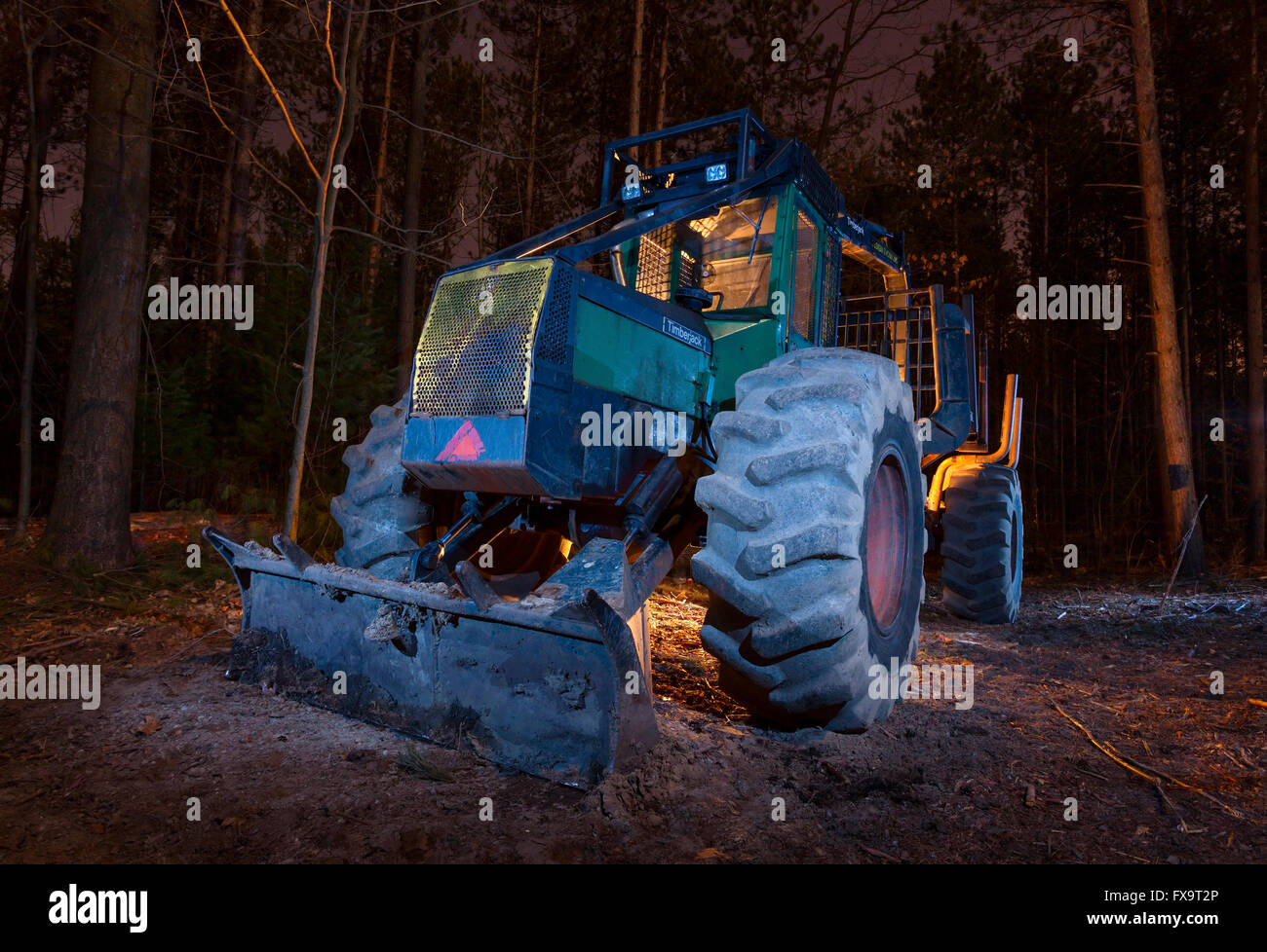 A forestry forwarder truck light painted during a long exposure at ...