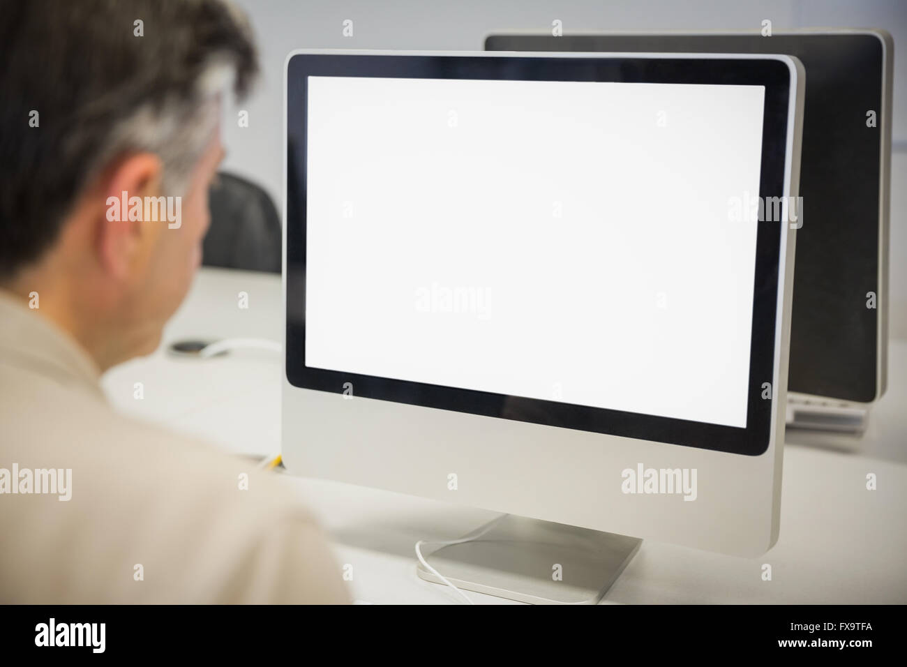 Professor using computer Stock Photo - Alamy