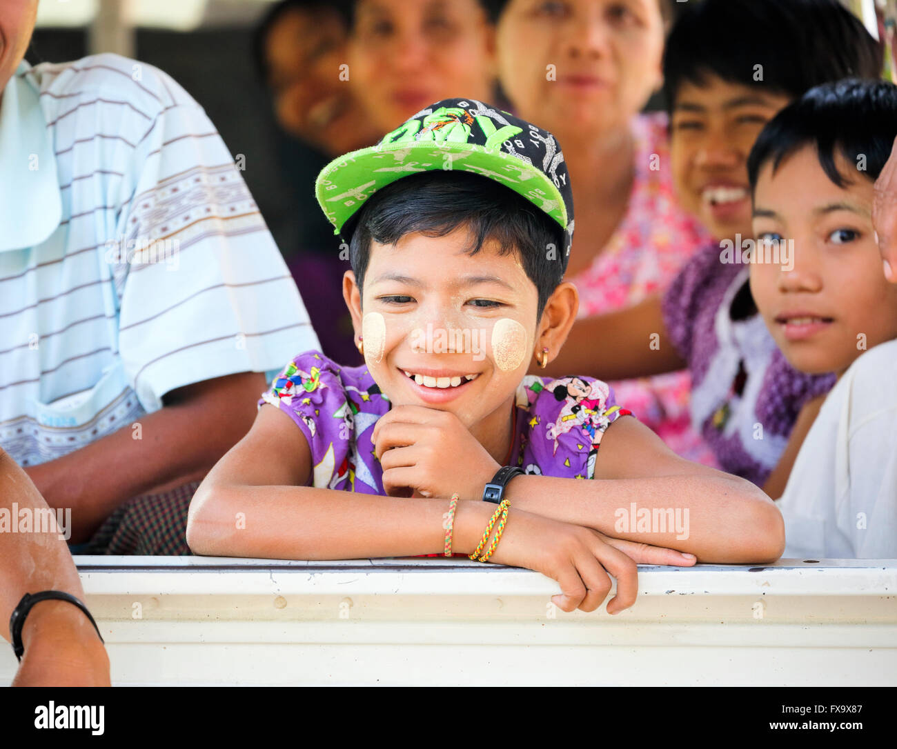Smiling local Burmese child with thanaka sunscreen at Kyauk Taw Gyi ...