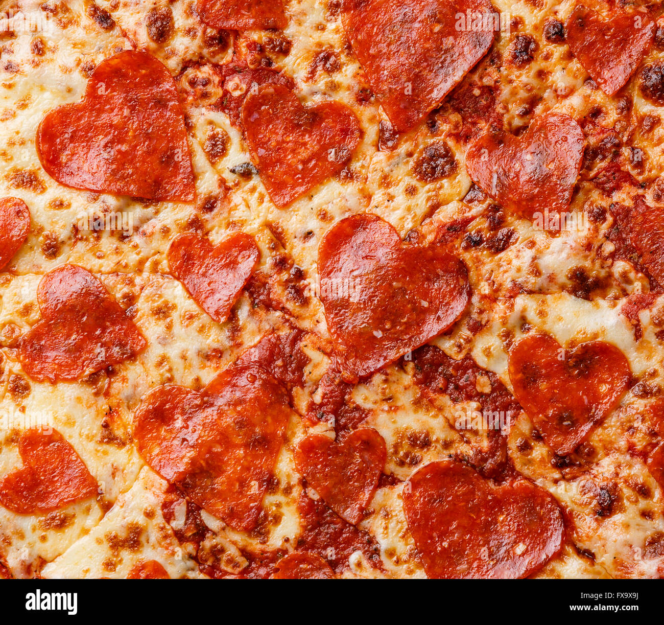 Heart shape Pepperoni Pizza close up background Stock Photo - Alamy