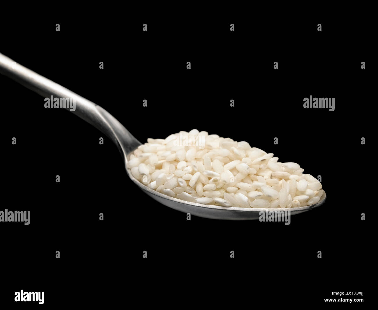 Aborio Rice isolated on a Spoon Stock Photo - Alamy