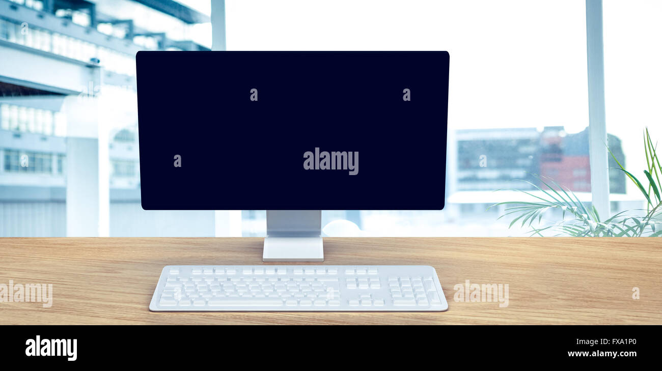 Composite image of a computer over a desk Stock Photo - Alamy