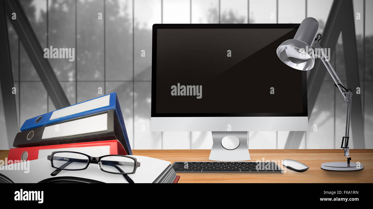 Composite image of image of a desk with computer Stock Photo - Alamy
