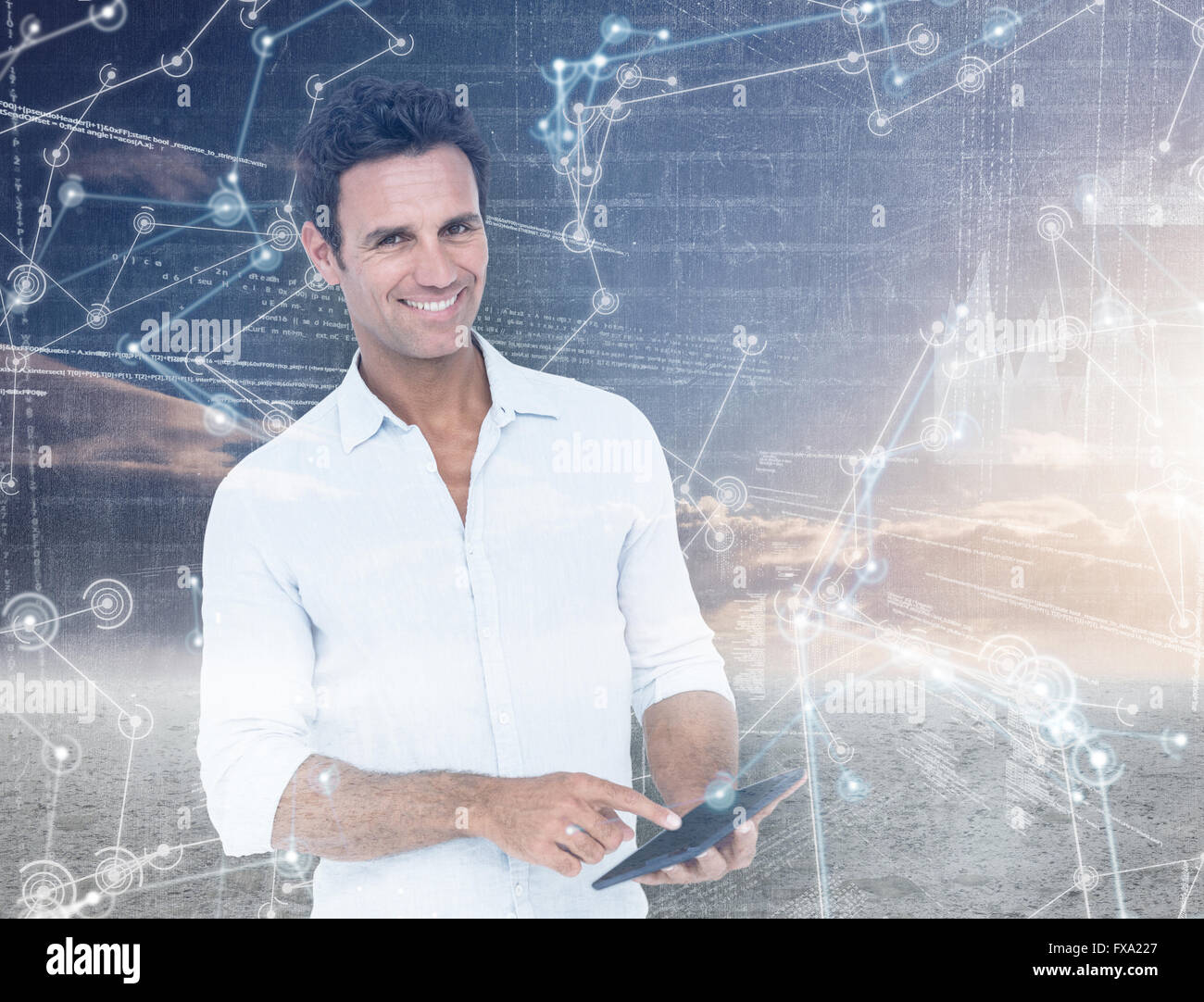 Composite image of portrait of smiling man using tablet computer Stock ...