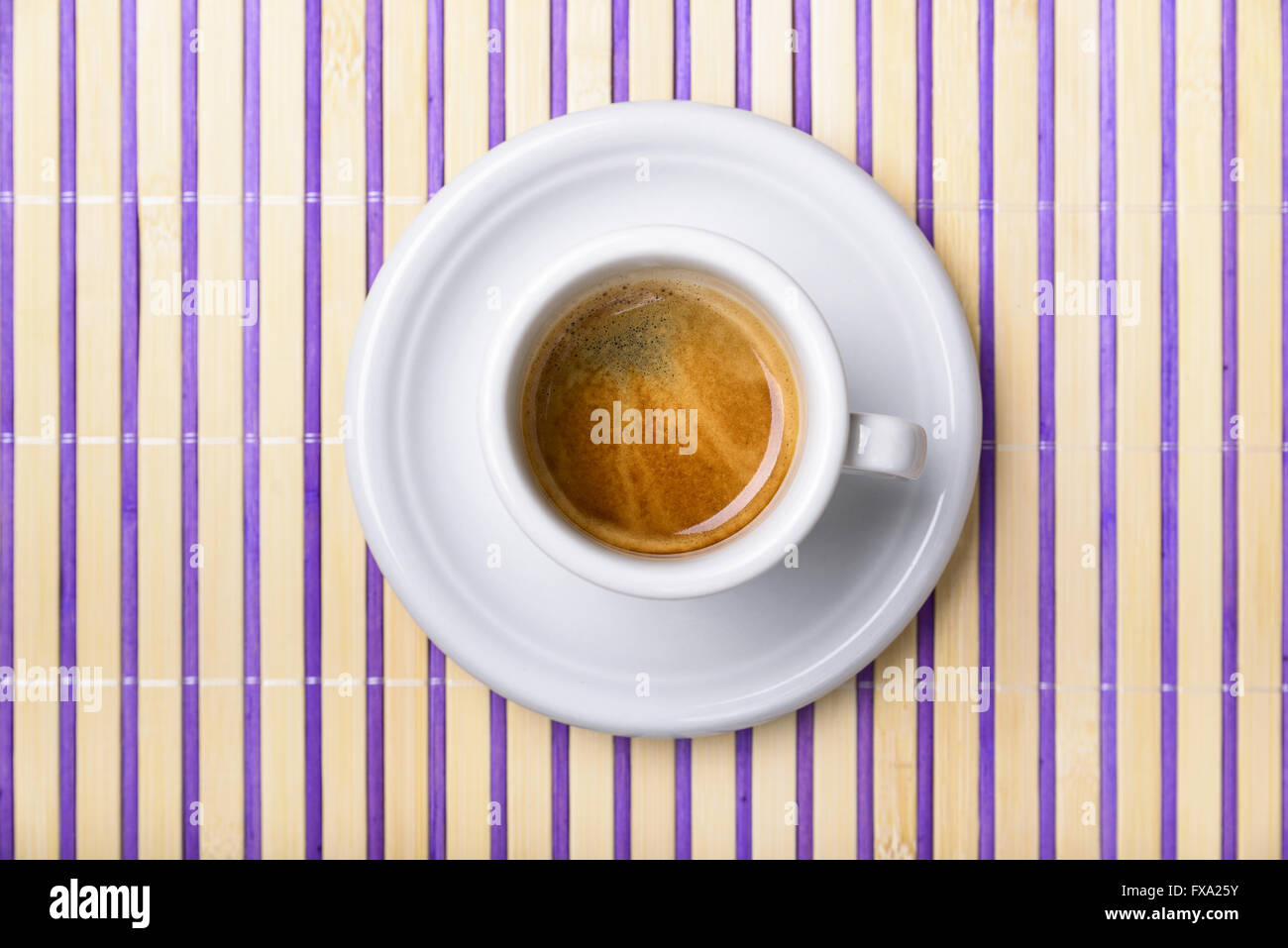 cup of coffee isolated on colored wooden placemat Stock Photo - Alamy