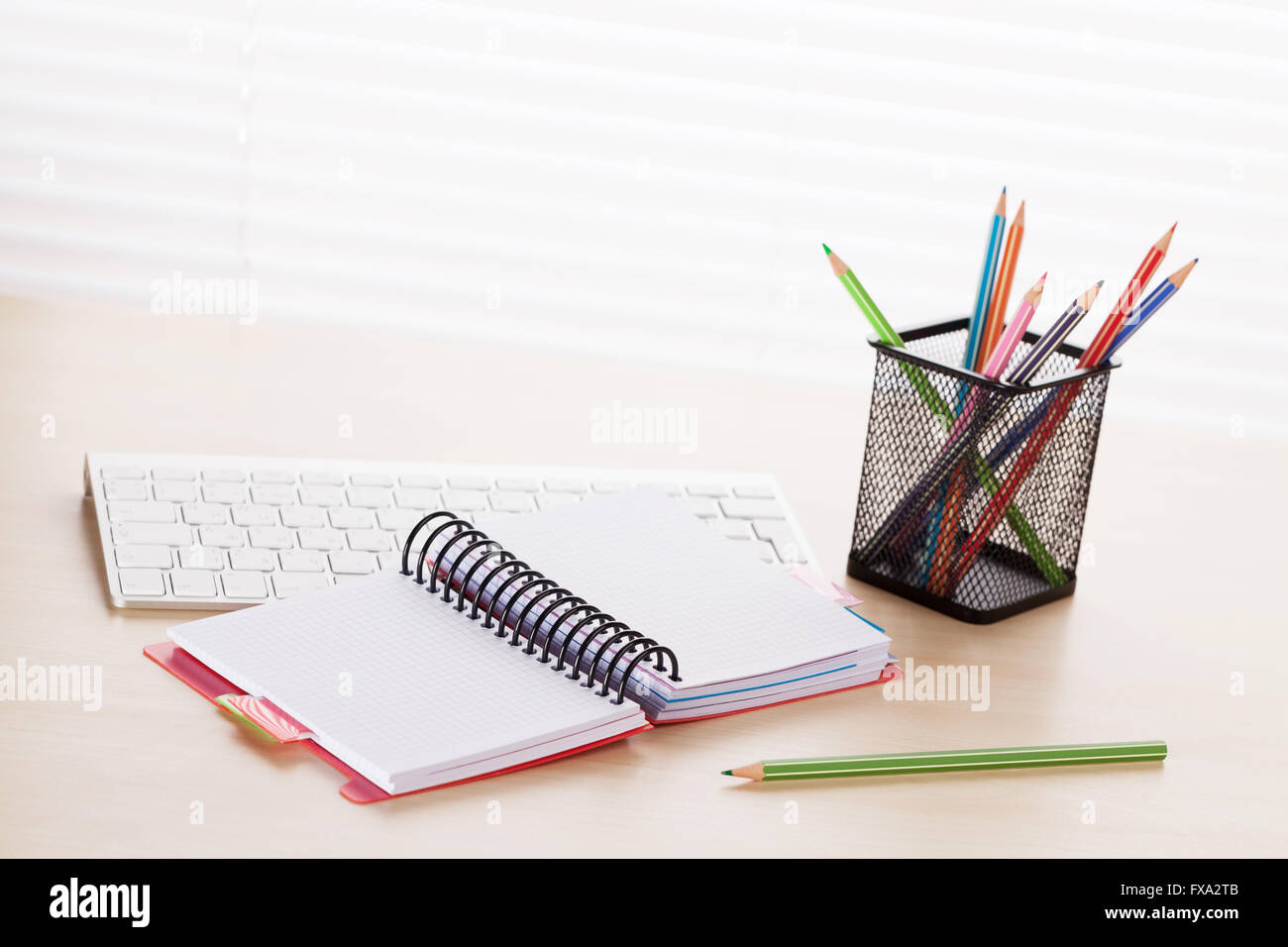 Office workplace with pc, notepad and pencils on wood desk table in ...