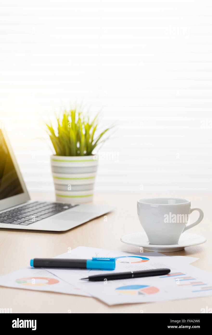 Office workplace with with laptop and coffee on wooden desk table in ...