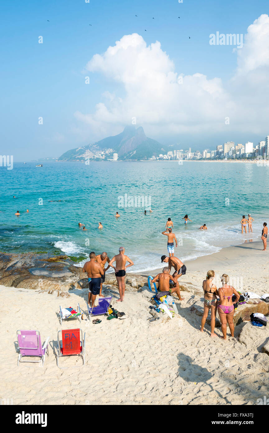 RIO DE JANEIRO - APRIL 5, 2016: Beachgoers sunbathe on a calm morning ...
