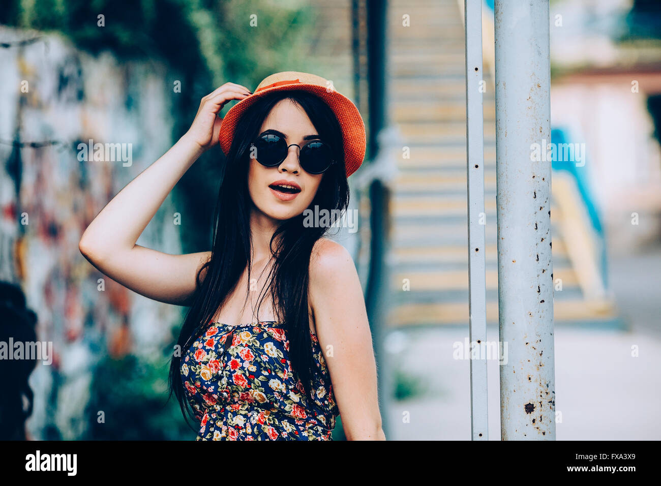 beautiful girl poses for camera in the city Stock Photo - Alamy