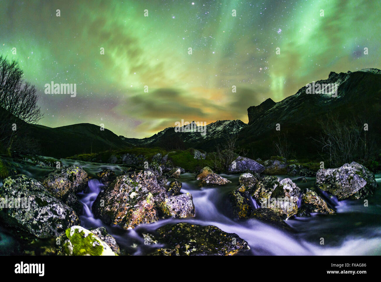 Aurora borealis over landscape with small river near the Sethaugelva ...