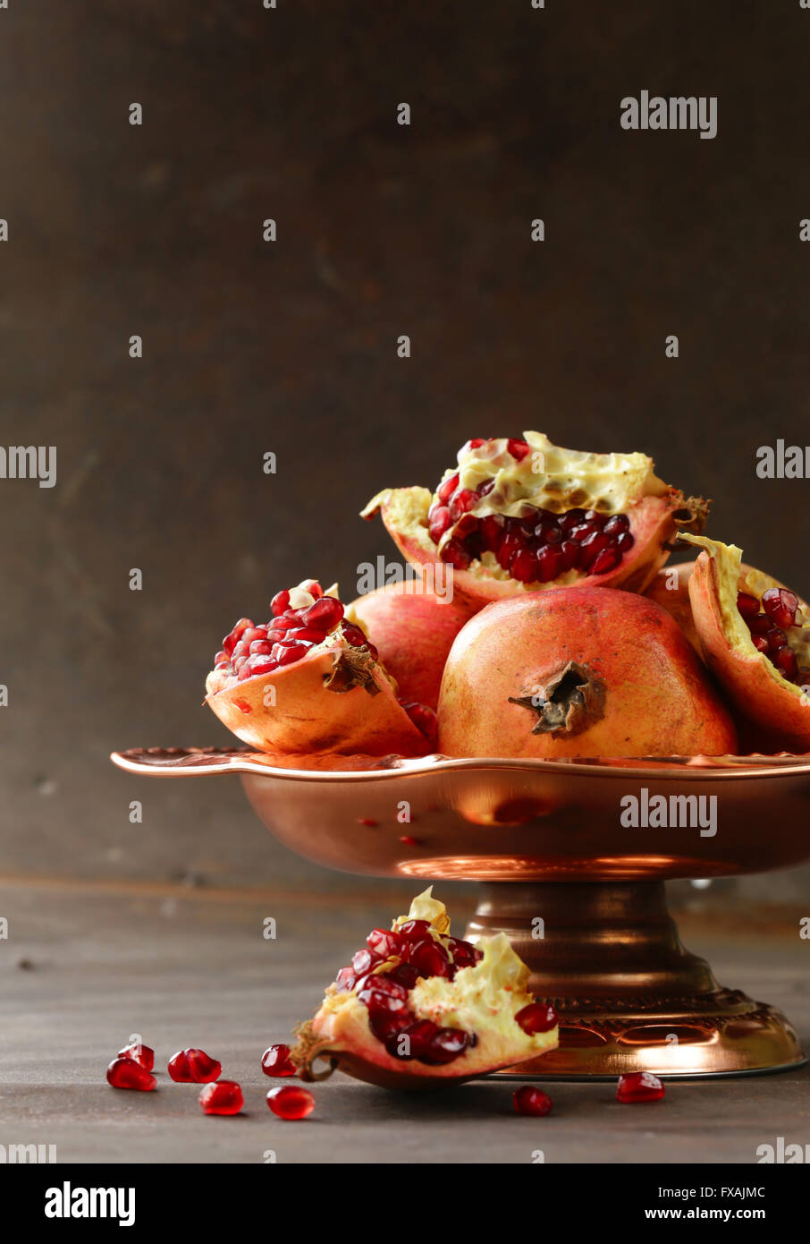 Organic ripe red fruit pomegranate, whole and broken Stock Photo - Alamy