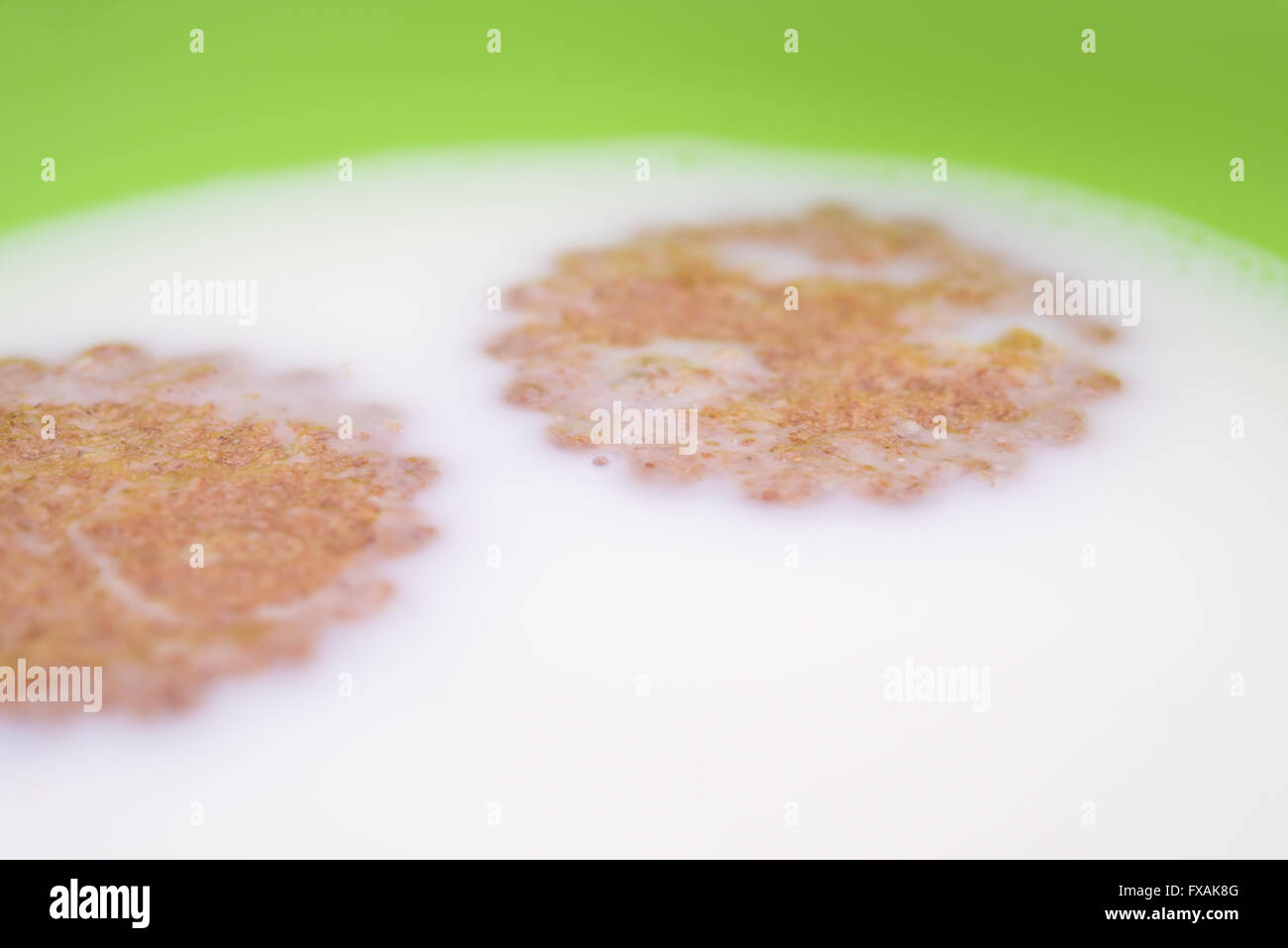 crackers floating on bowl of milk close up Stock Photo - Alamy