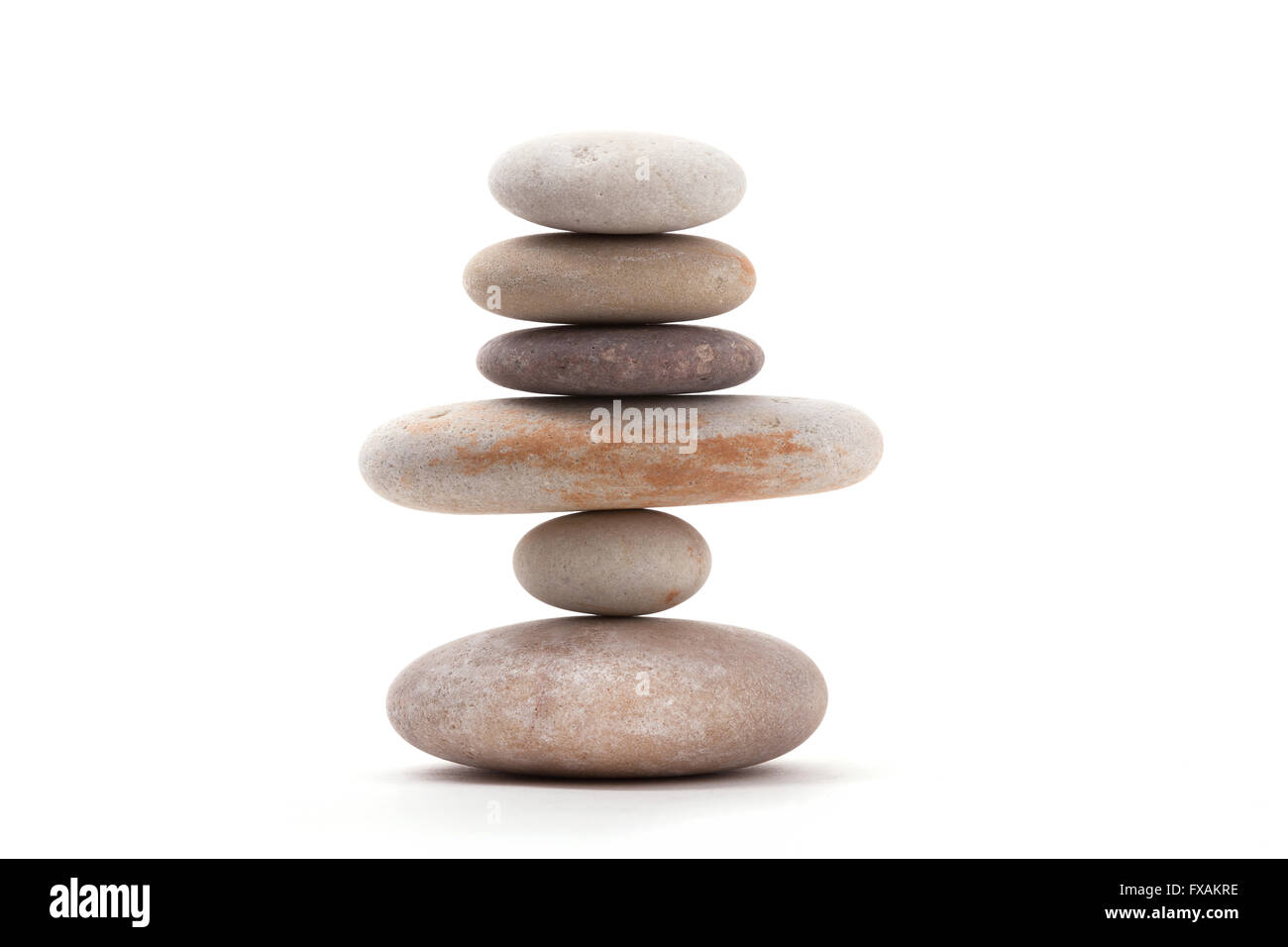 Pile of balancing pebble stones, like ZEN stone, isolated on white ...