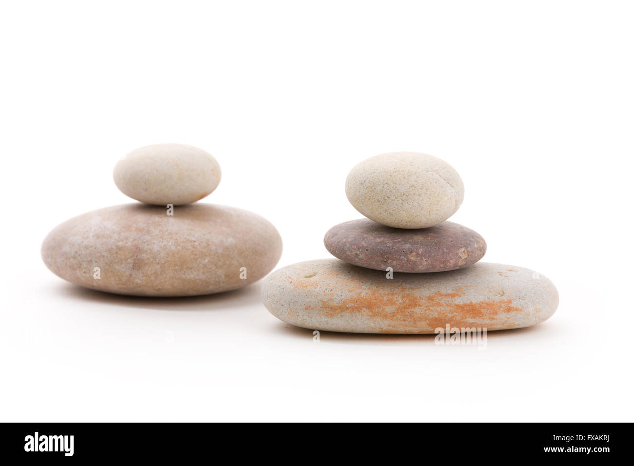 Pile of balancing pebble stones, like ZEN stone, isolated on white ...