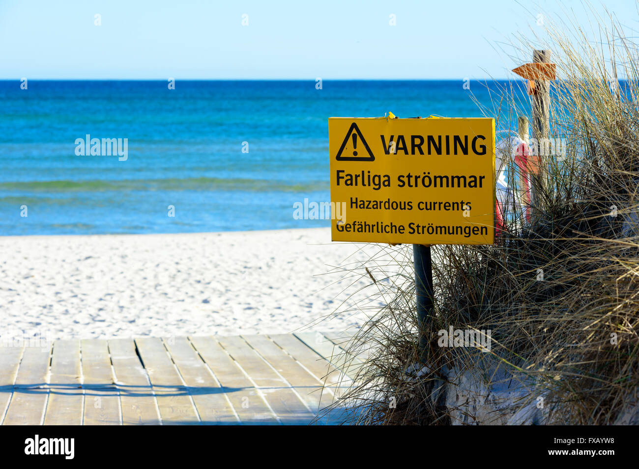 Sandhammaren, Sweden - April 1, 2016: Yellow warning sign about ...