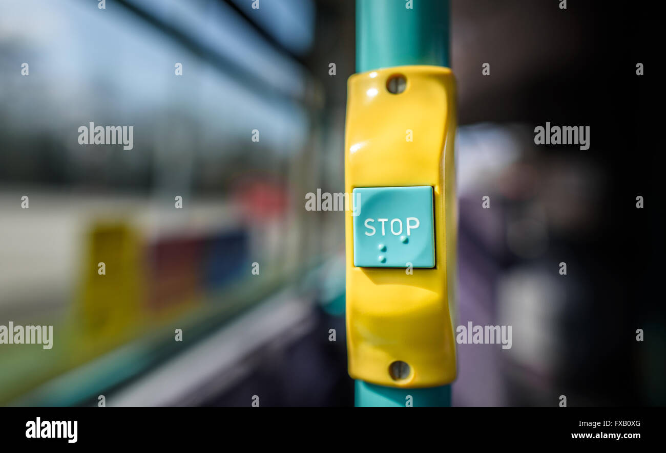 A stop button on a public bus with additional braille Stock Photo - Alamy