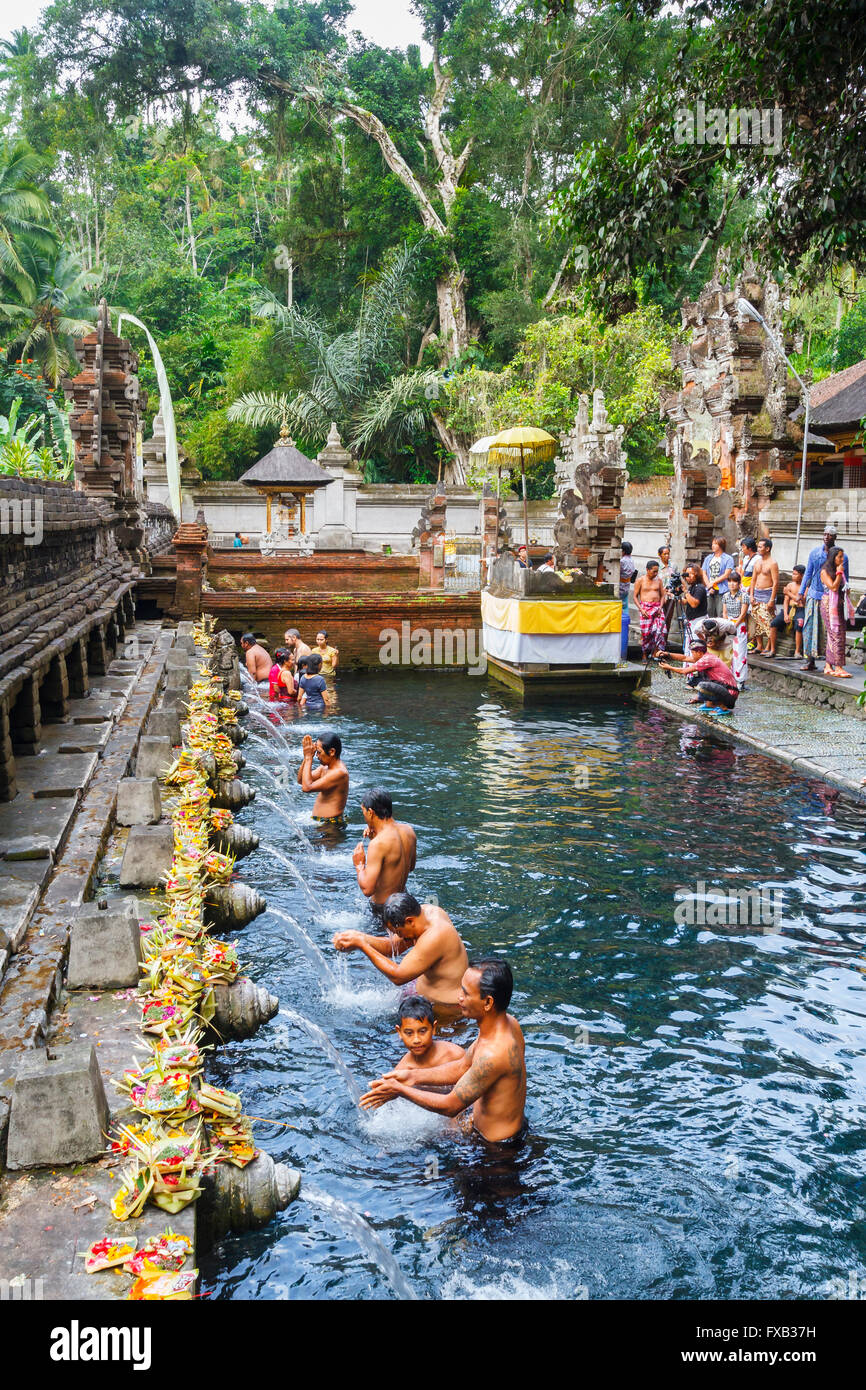 Sacred water at tanah lot temple hi-res stock photography and images ...