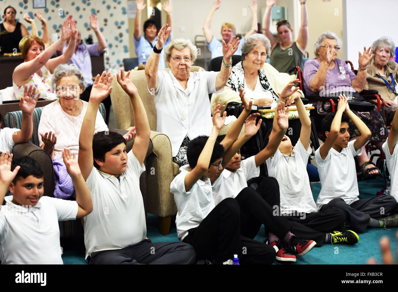 School children visit an elderly people's care home to develop ...