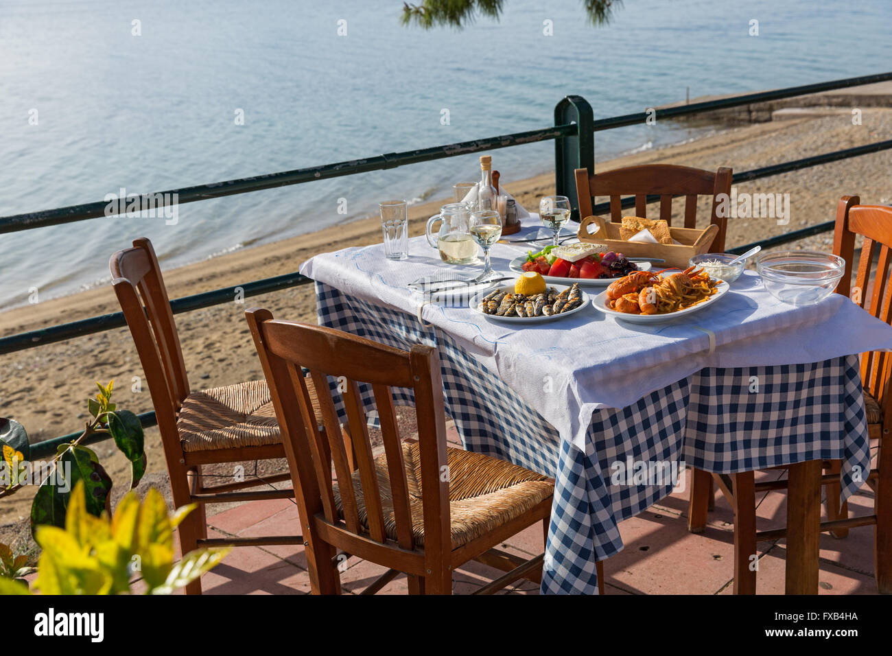 Table for dinner in a fish restaurant by the sea Stock Photo - Alamy
