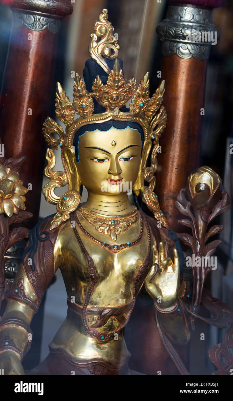 Tara Statue. Buddhist deity statue in a shop window. Glastonbury ...