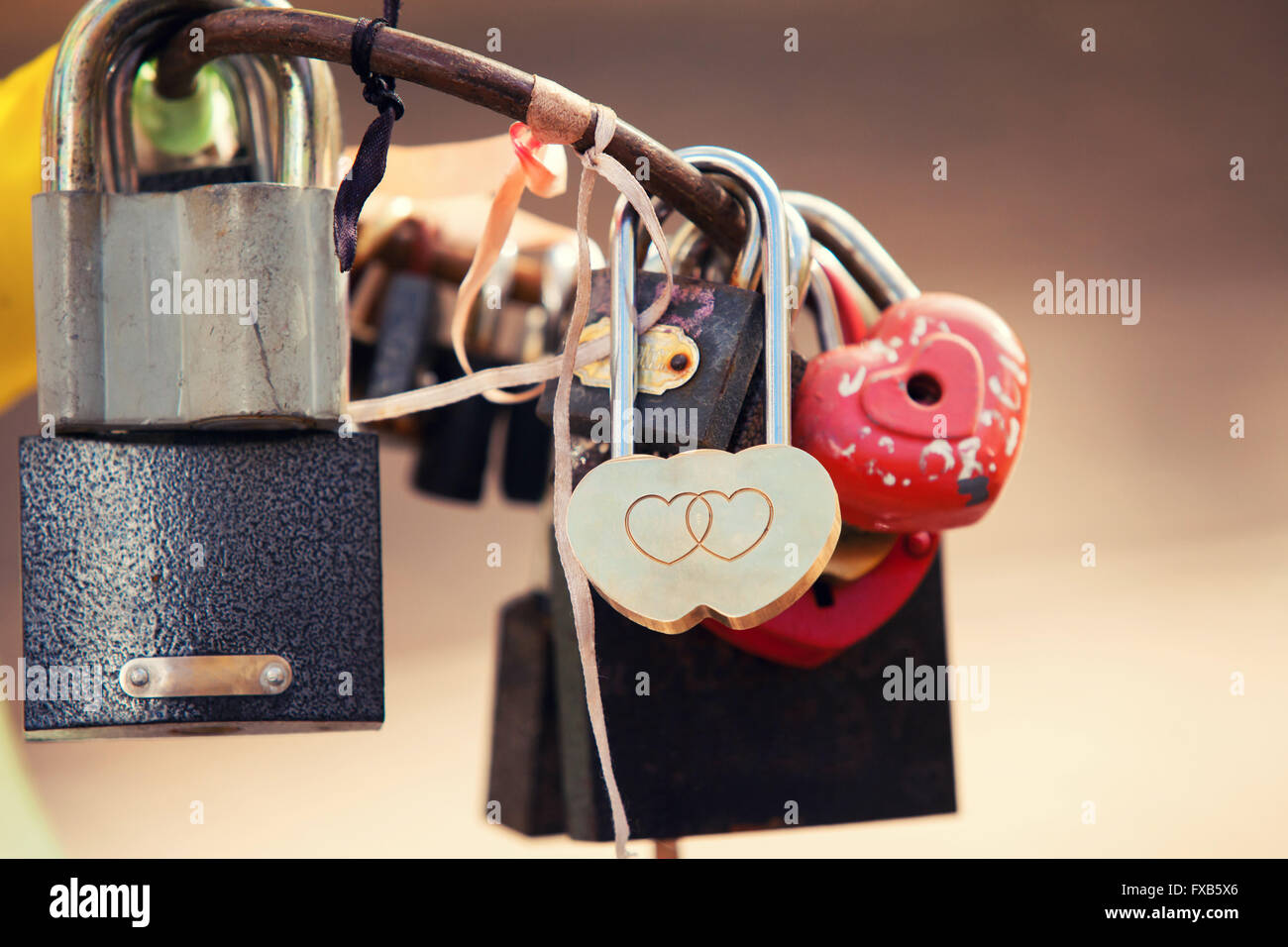 the gold wedding lock in the form of heart Stock Photo - Alamy