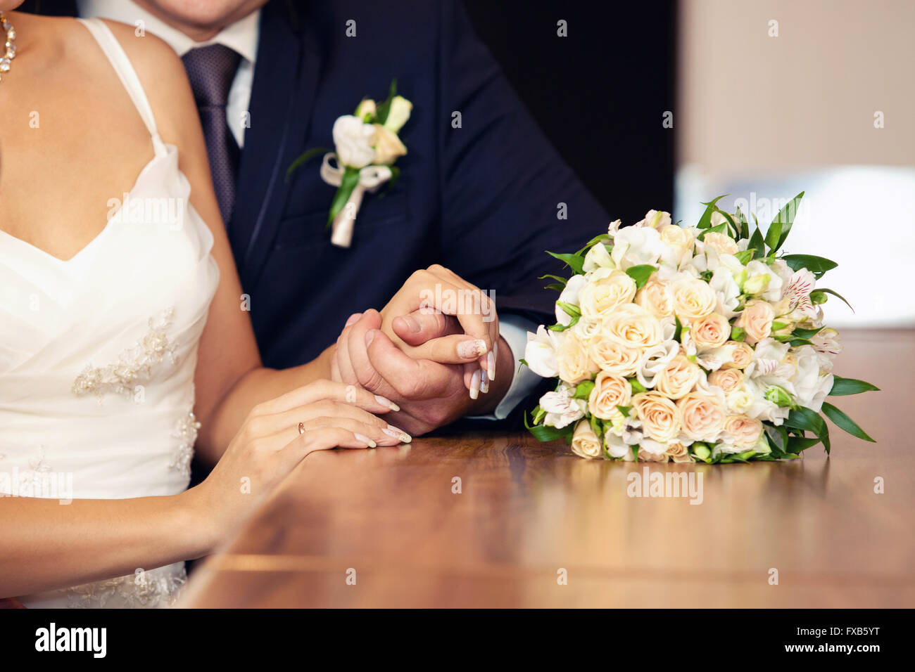 the groom and the bride hold each other by hands Stock Photo - Alamy